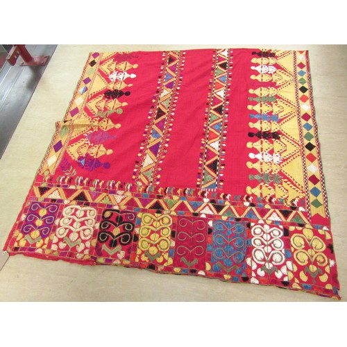 A Middle Eastern silk embroidered cloth in vibrant colours, possibly ...