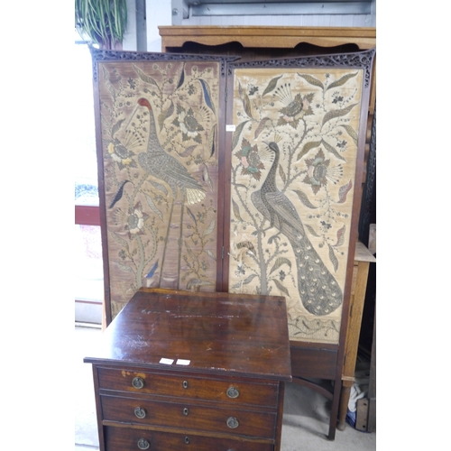 An Edwardian mahogany embroidered silk room screen with peacock design