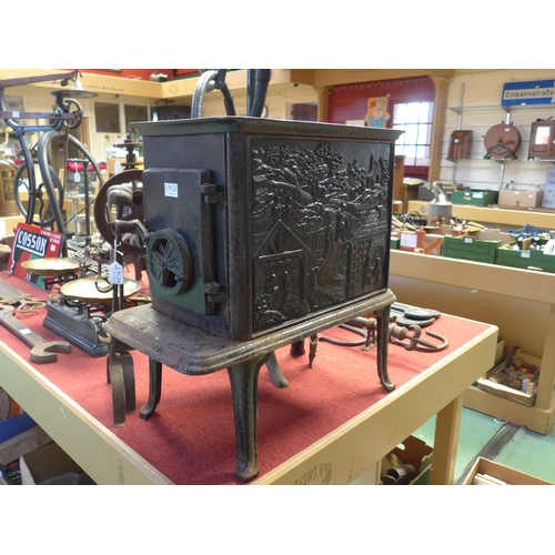 A cast stove with decorative side panels