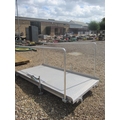 An aluminium chequered plate ramp