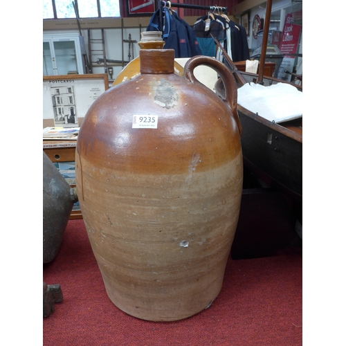 A large Victorian salt glazed flagon with handle, 52cm tall