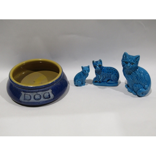 A Bourne Denby ceramic dog bowl, three blue ceramic cats and a white ...