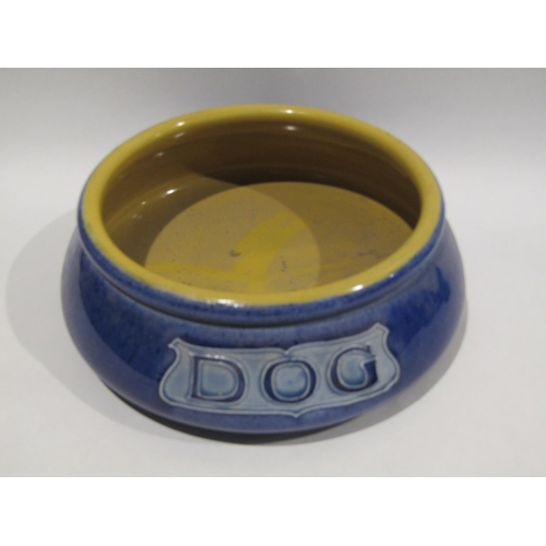 A Bourne Denby ceramic dog bowl, three blue ceramic cats and a white ...