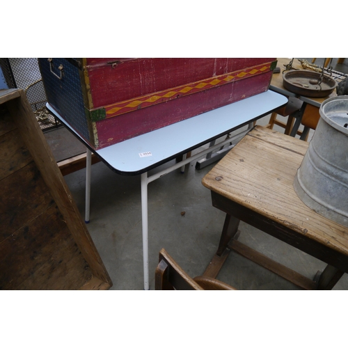 A mid century formica top kitchen table