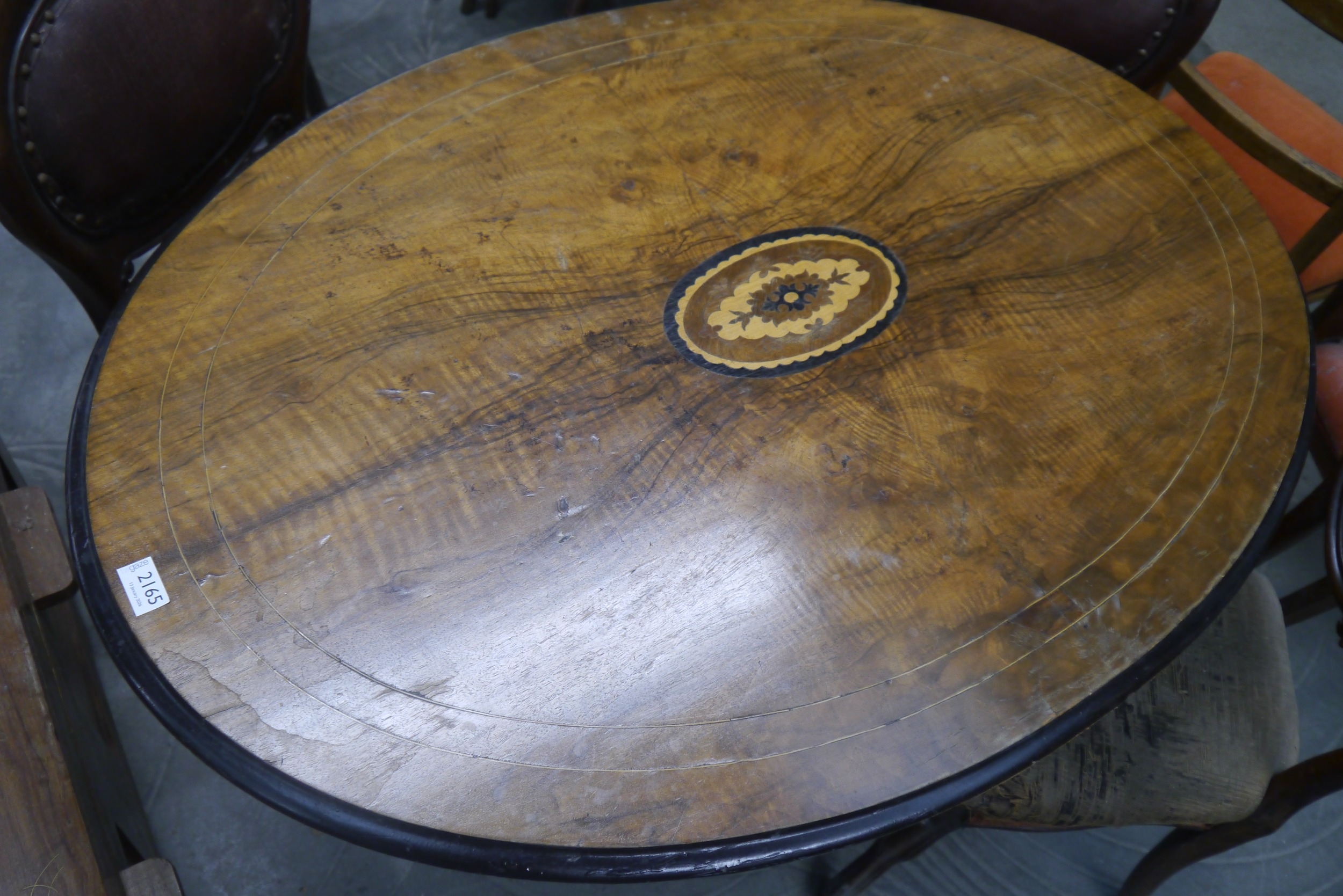 A Victorian figured walnut inlaid loo table