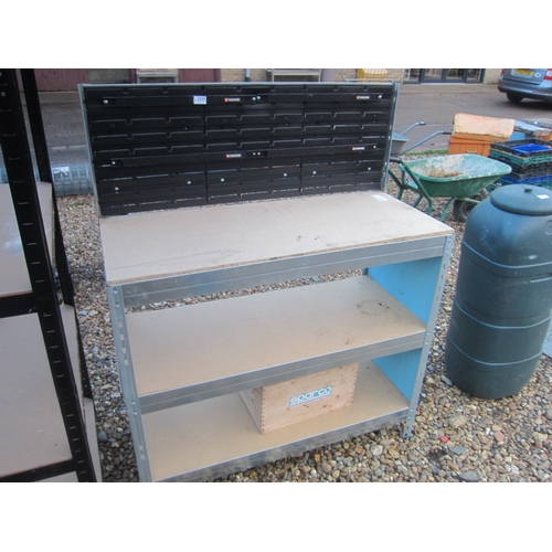 A work bench with lin bins