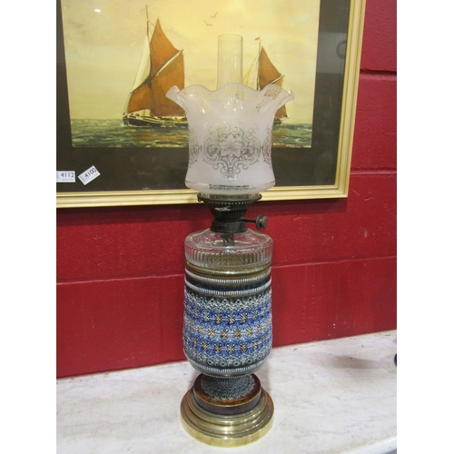 A J Hinks & Son oil lamp, Doulton glazed body on brass stepped base ...