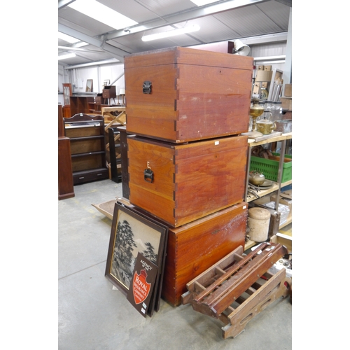 Three mahogany shipping trunks
