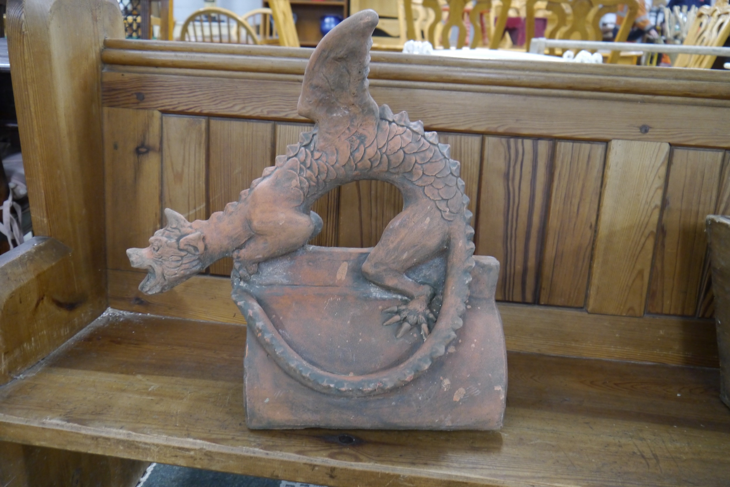 A terracotta dragon roof finial