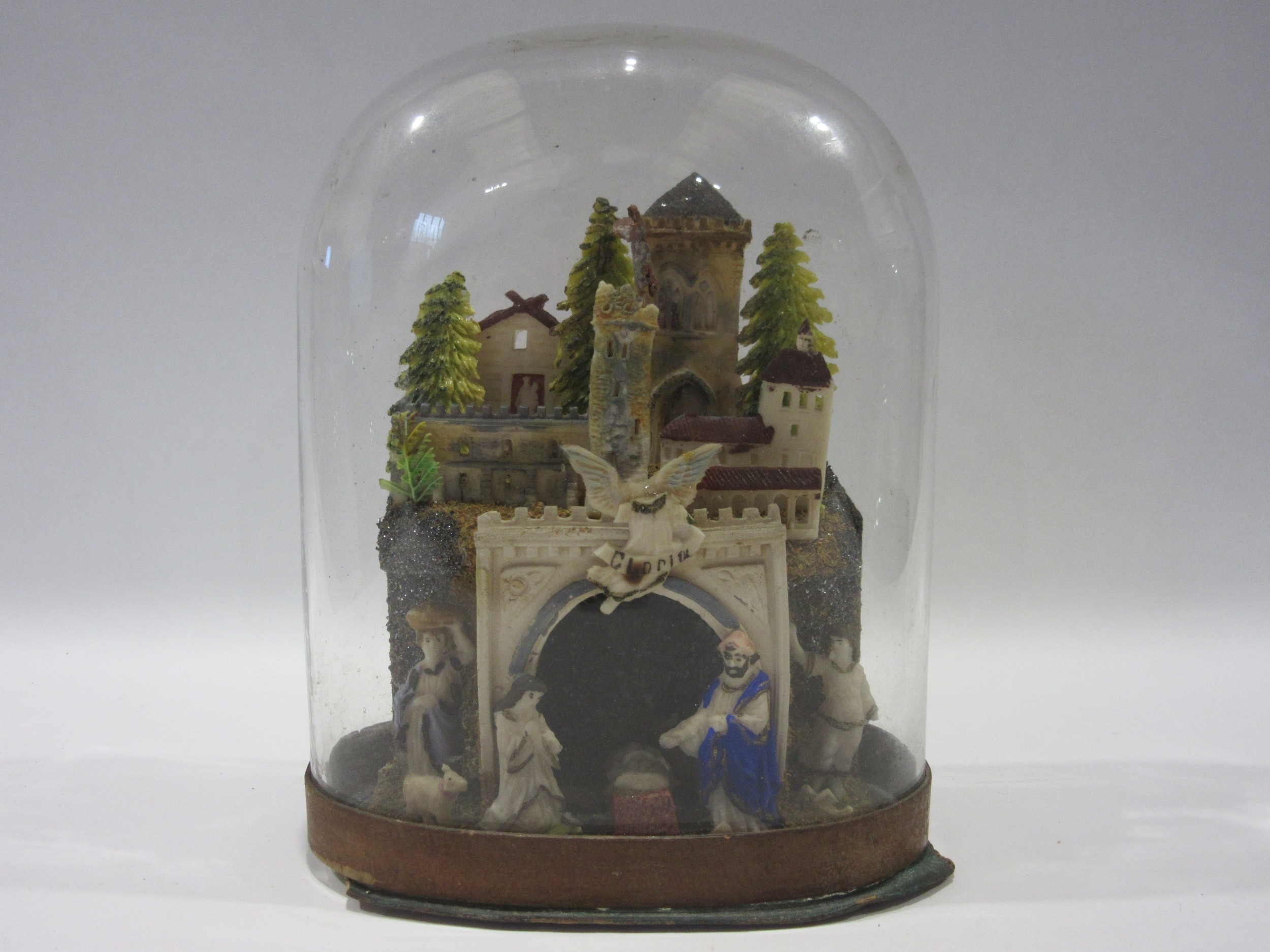 A Continental naïve pottery nativity scene, housed within a glass ...