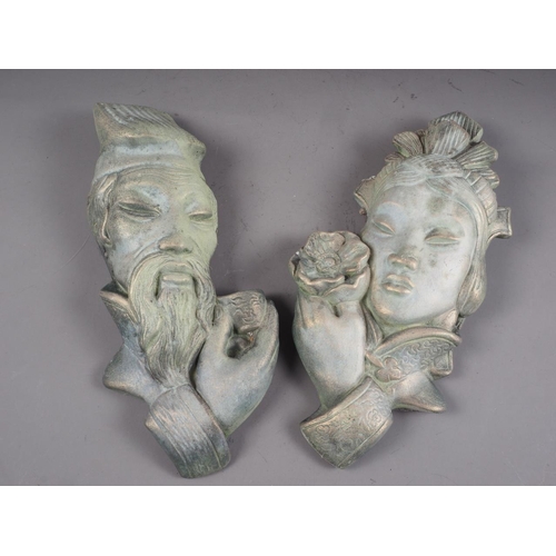 A pair of painted and gilt plaster busts, 60" high, and a terracotta ...