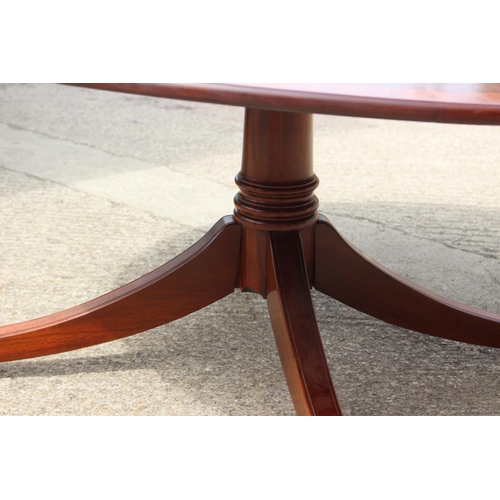 A mahogany and banded circular dining table of Georgian design, on ...