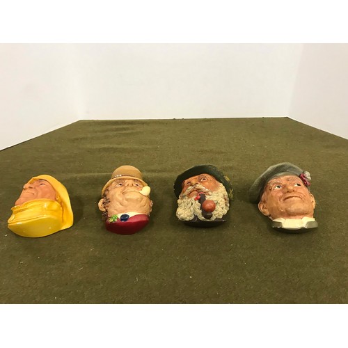Four mixed chalk character heads
