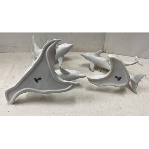 TWO DOLPHIN SCULPTURES IN WHITE BY KAISER