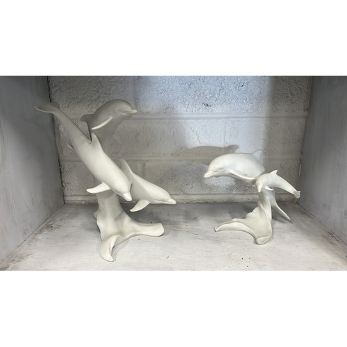 TWO DOLPHIN SCULPTURES IN WHITE BY KAISER