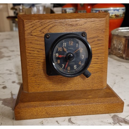 Working clock from Spitfire fighter plane, on bespoke oak mount stand