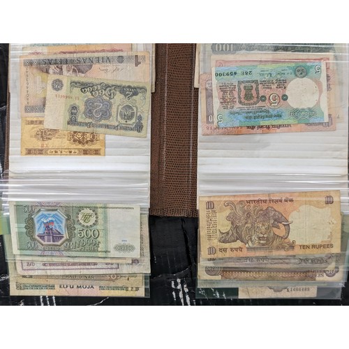 Brown folder with 40 x assorted foreign bank notes
