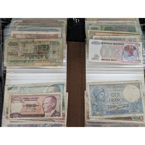 Brown folder with 40 x assorted foreign bank notes