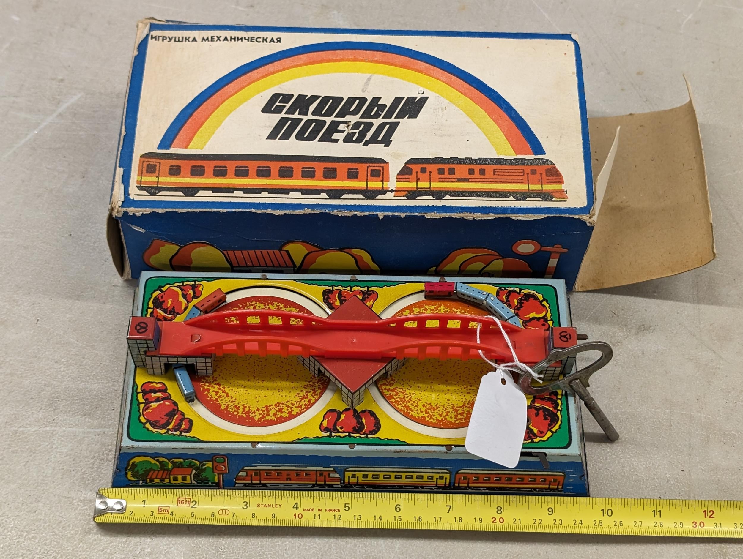 Boxed vintage foreign tin plate wind up train toy with key in working order