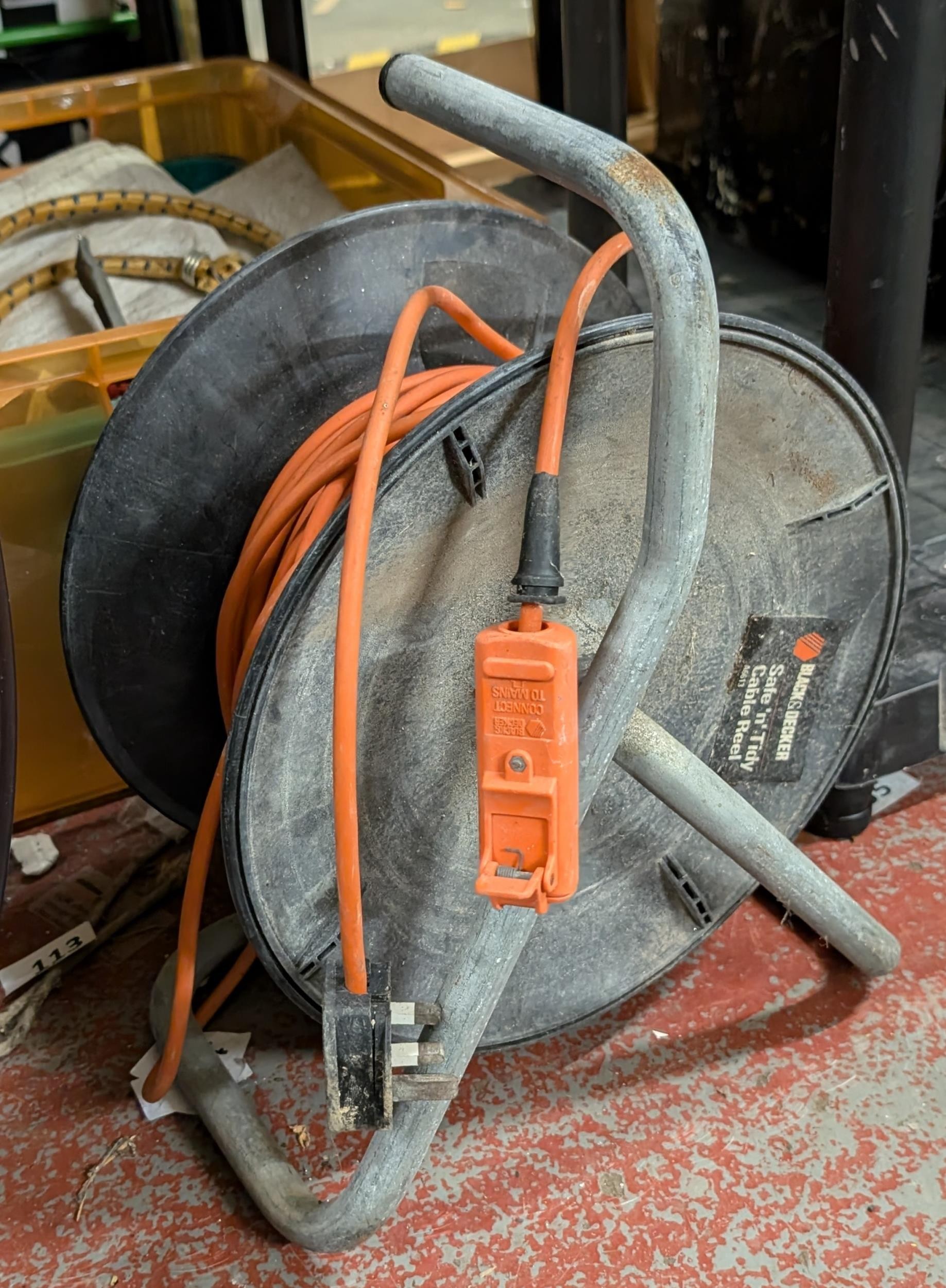 Black and Decker cable tidy reel with orange outdoor extension lead
