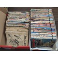 Collection of 80+vintage Commando pocket comics in varying condition