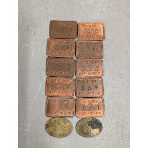 10 x British Railway western region pay cheque token's and 2 x P.H.G tokens