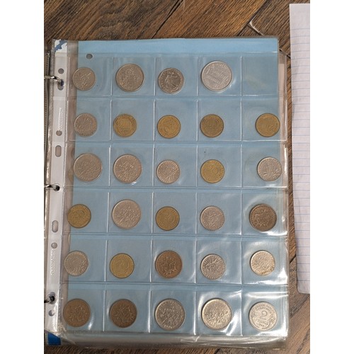 coin folder of coins from around the world