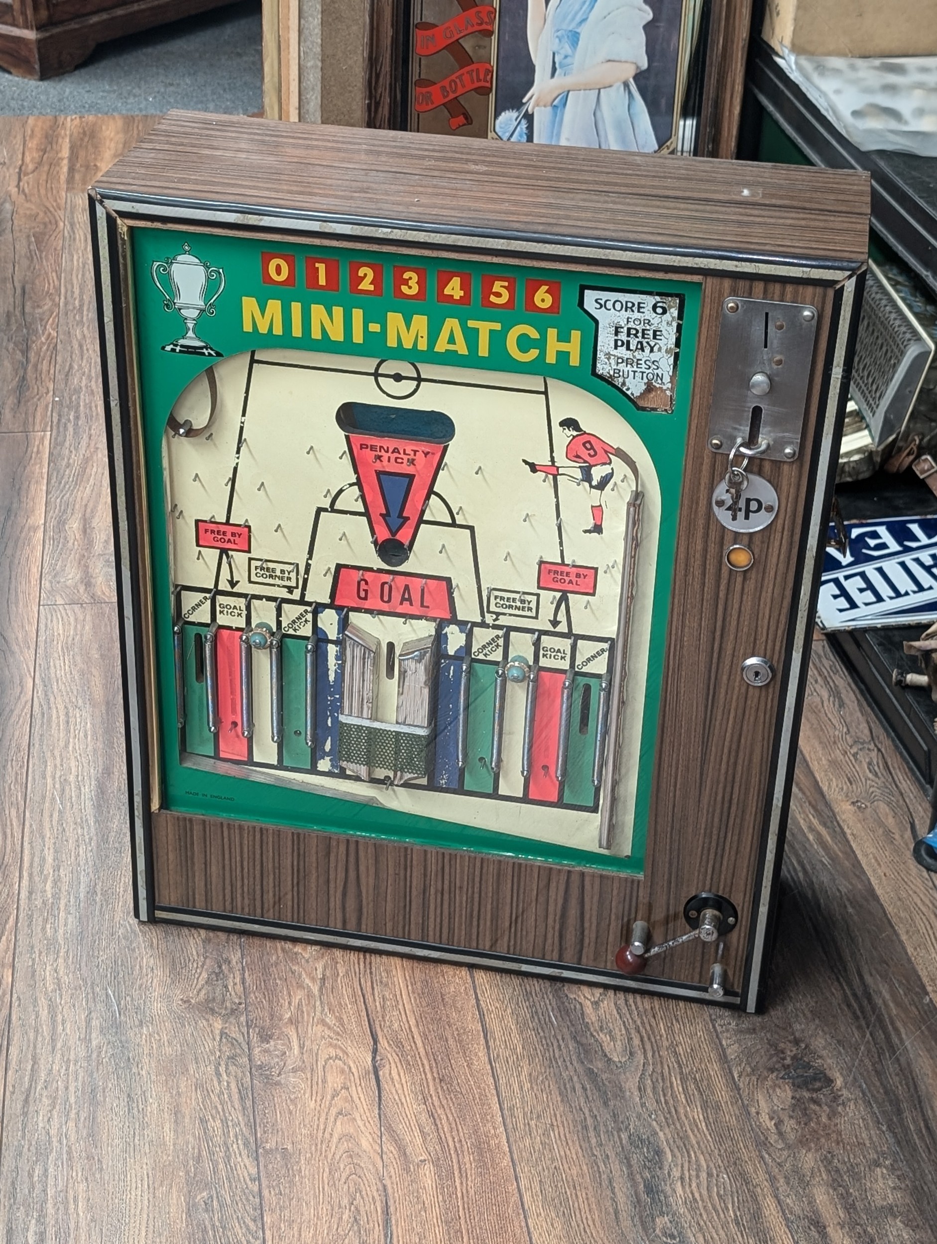 A vintage coin-operated 'Mini-Match' arcade football game, made in ...