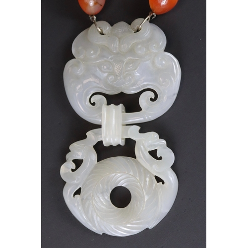 A White Jade Interlocking Pendant, and a Burnt Jade Cat, 19/20th ...