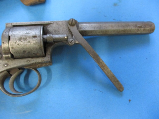 An antique 6 shot pin-fire revolver with original leather holster ...