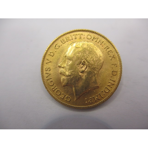 A George V gold half sovereign dated 1911, a circulated coin with fine ...
