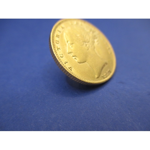 A Victorian gold sovereign dated 1857, a circulated coin with fine ...