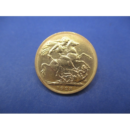 A George V gold sovereign dated 1928 a circulated coin with fine ...