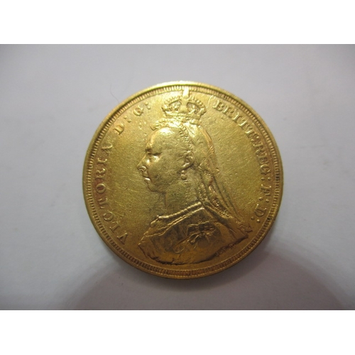 A Victorian gold sovereign dated 1888, a circulated coin with fine ...