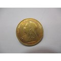 A Victorian gold sovereign dated 1899, a circulated coin with fine ...