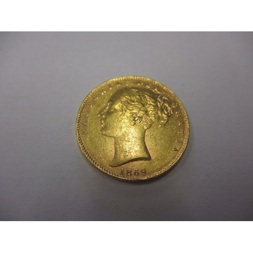A Victorian gold sovereign dated 1869, shield back, a circulated coin ...