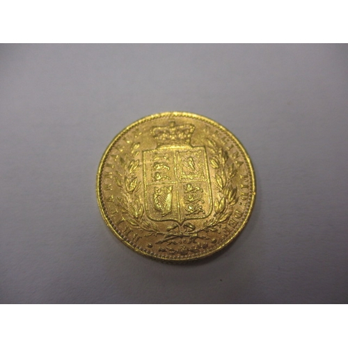 A Victorian gold sovereign dated 1869, shield back, a circulated coin ...