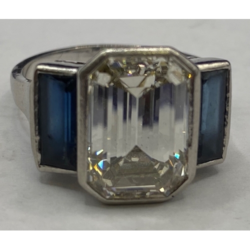 A platinum ring set with a natural rectangular step cut diamond of ...
