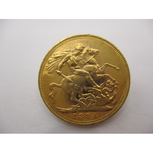 A Victorian gold sovereign dated 1894, a circulated coin with fine ...