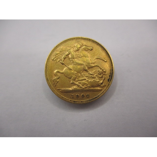 An Edward VII gold half sovereign dated 1902, a circulated coin with ...