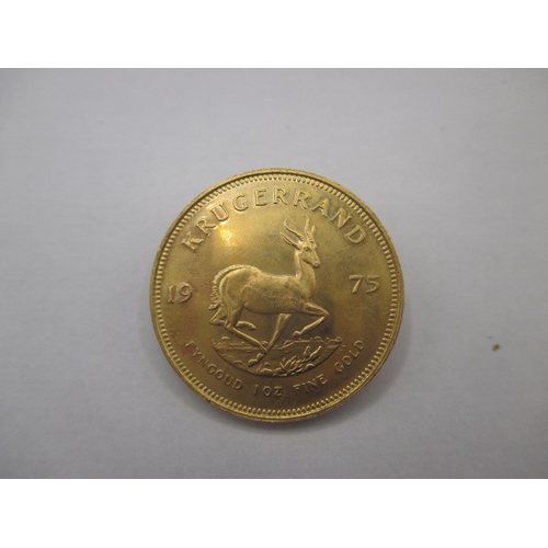 A 1975 Gold Krugerrand coin, a near uncirculated coin