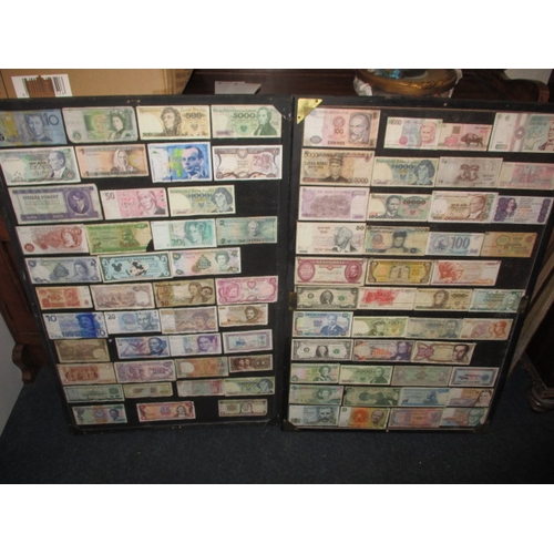 A collection of vintage world bank notes, in glazed frames