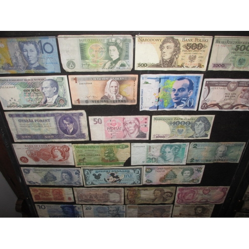 A collection of vintage world bank notes, in glazed frames