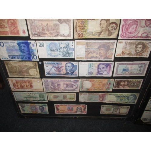 A collection of vintage world bank notes, in glazed frames