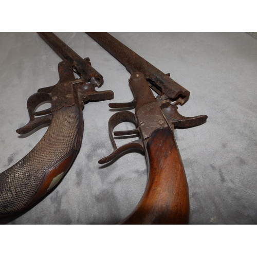 Two percussion lock pistols with octagonal barrels, one with chequered ...