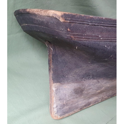 A very large carved wooden hull of a boat made from a single piece of ...
