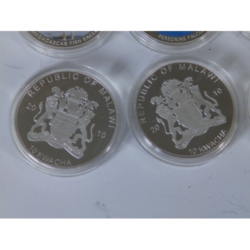 12 modern Malawi 10 Kwacha silver plated 'Bird of Prey' coins.