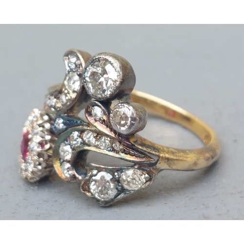 A Victorian ruby and diamond set dress ring, of scrolling design ...