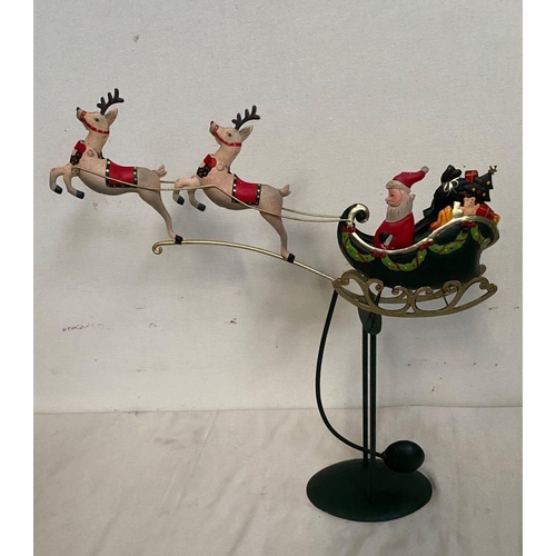 **WITHDRAWN** A ROCKING PENDULUM CHRISTMAS ORNAMENT, depicting Santa in ...