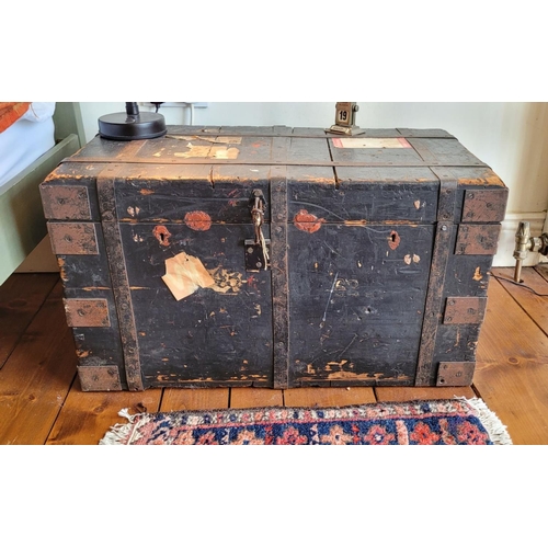 A METAL BOUND SHIPPING / TRAVEL TRUNK, with hinged leg & wrought metal ...